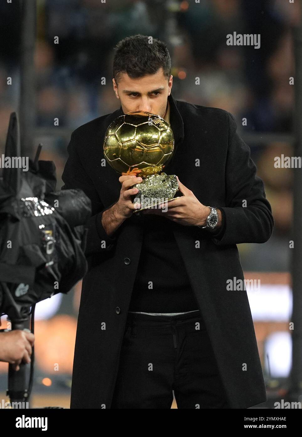 Manchester City's Rodri poses with the Ballon d'Or trophy before the ...
