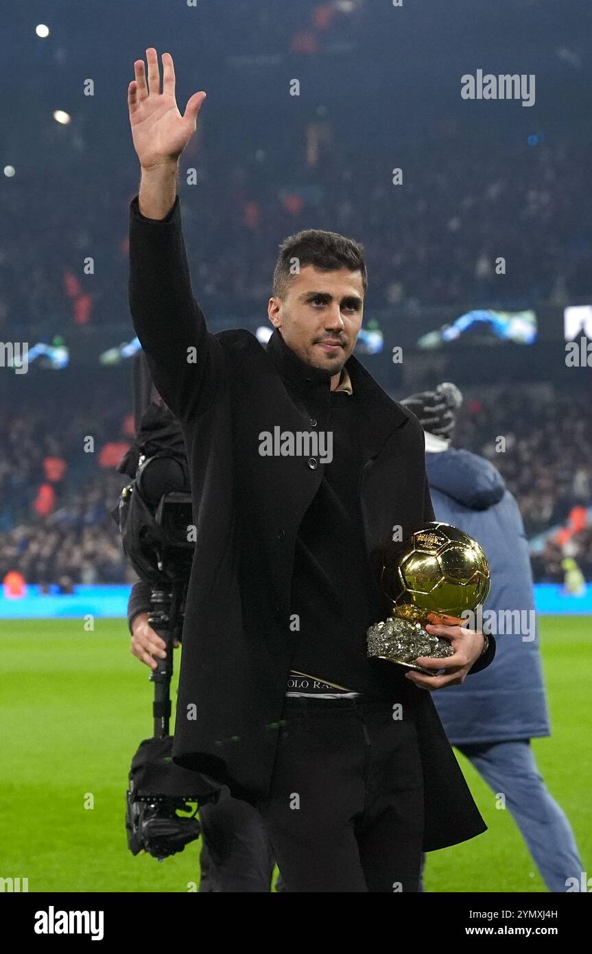 Manchester City's Rodri with the Ballon d'Or trophy before the Premier ...