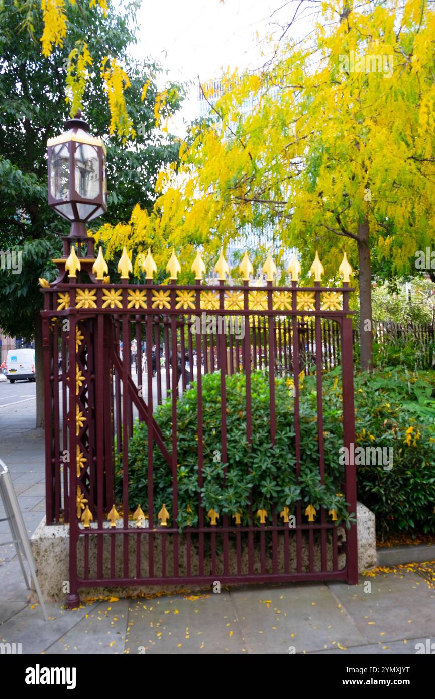 Decorative historic ornamental iron railing with gold paint outside St ...