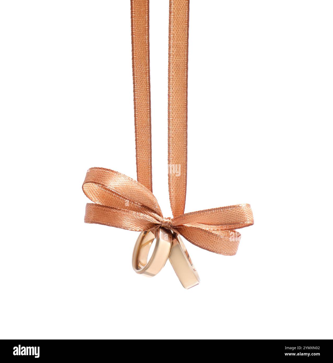 Wedding rings tied with ribbon on white background Stock Photo - Alamy