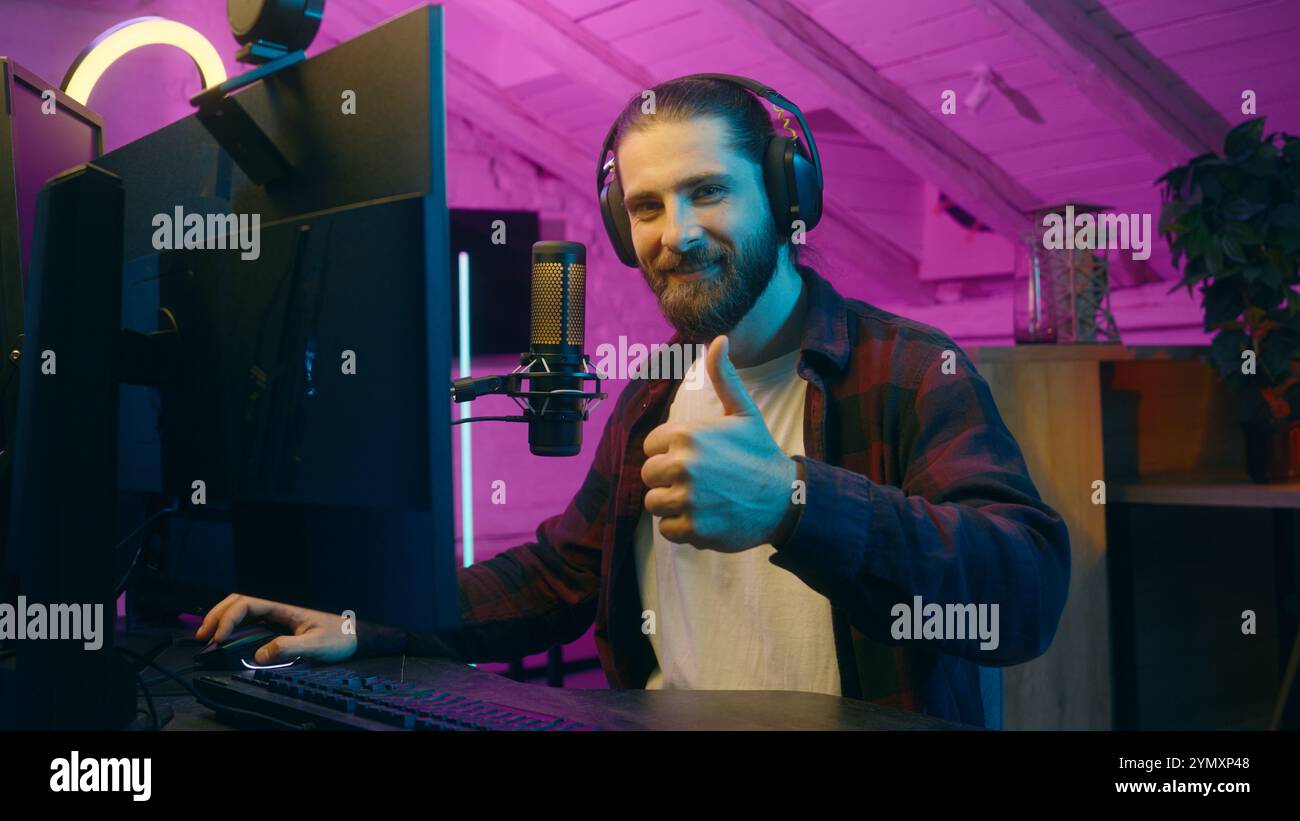 Smiling vlogger showing thumb hi-res stock photography and images - Alamy