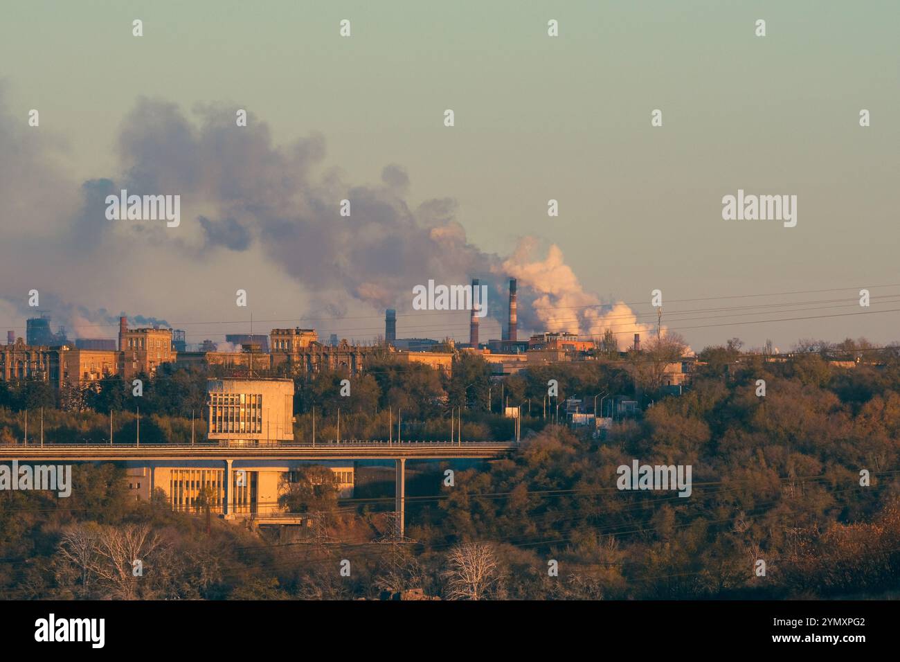 A dramatic and captivating view of multiple factories and tall ...