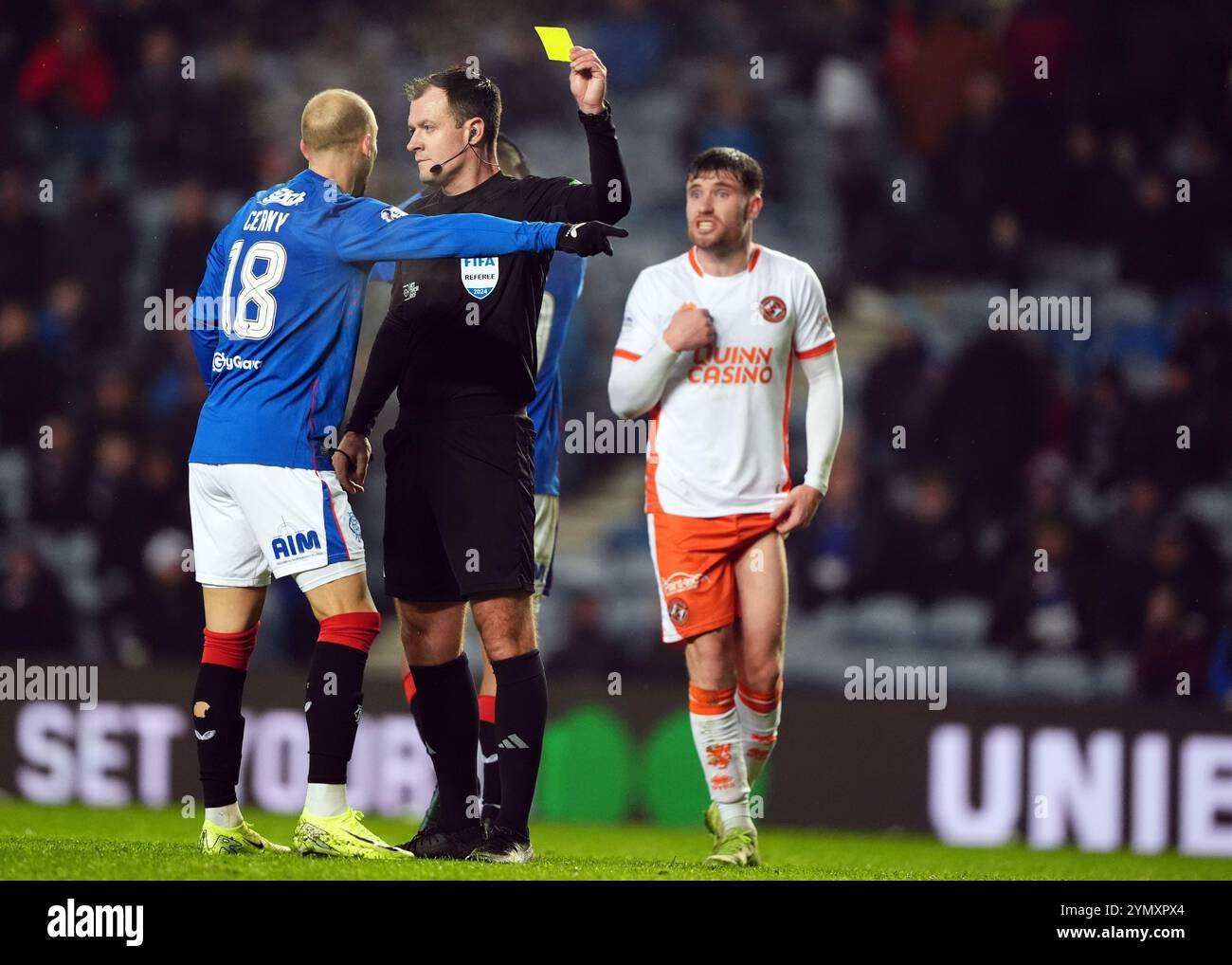 Rangers' Vaclav Cerny is shown a yellow card by referee Don Robertson ...