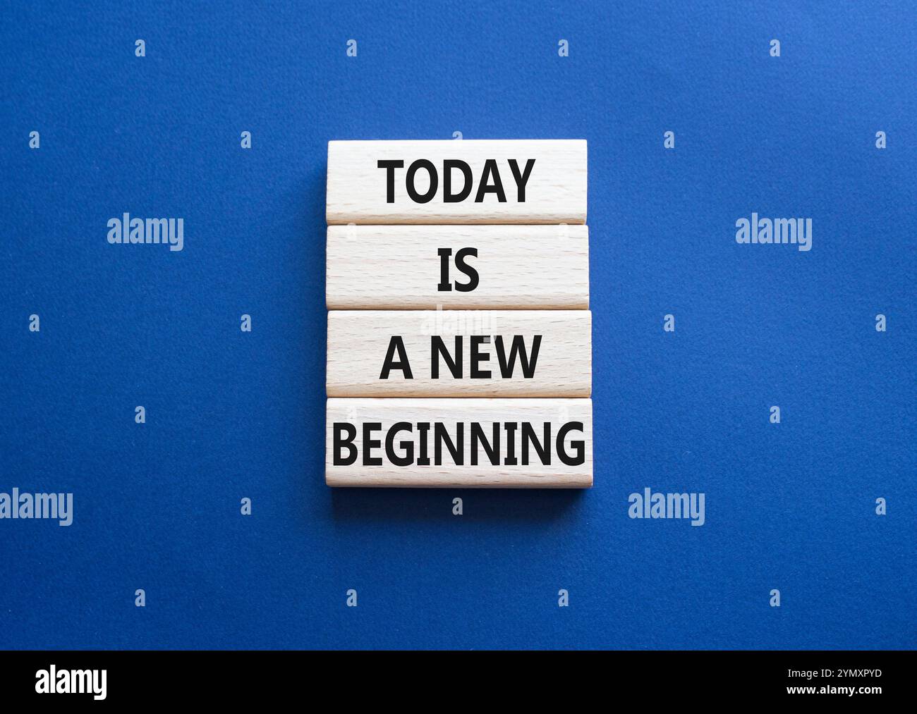 Today is a new beginning symbol. Wooden blocks with words Today is a ...