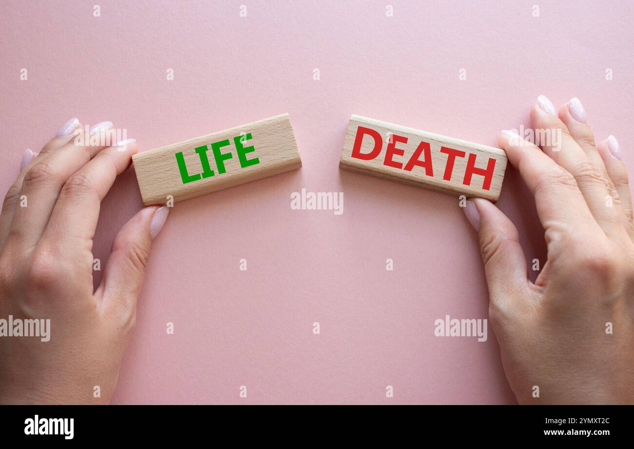 Life or Death symbol. Concept word Life or Death on wooden blocks ...