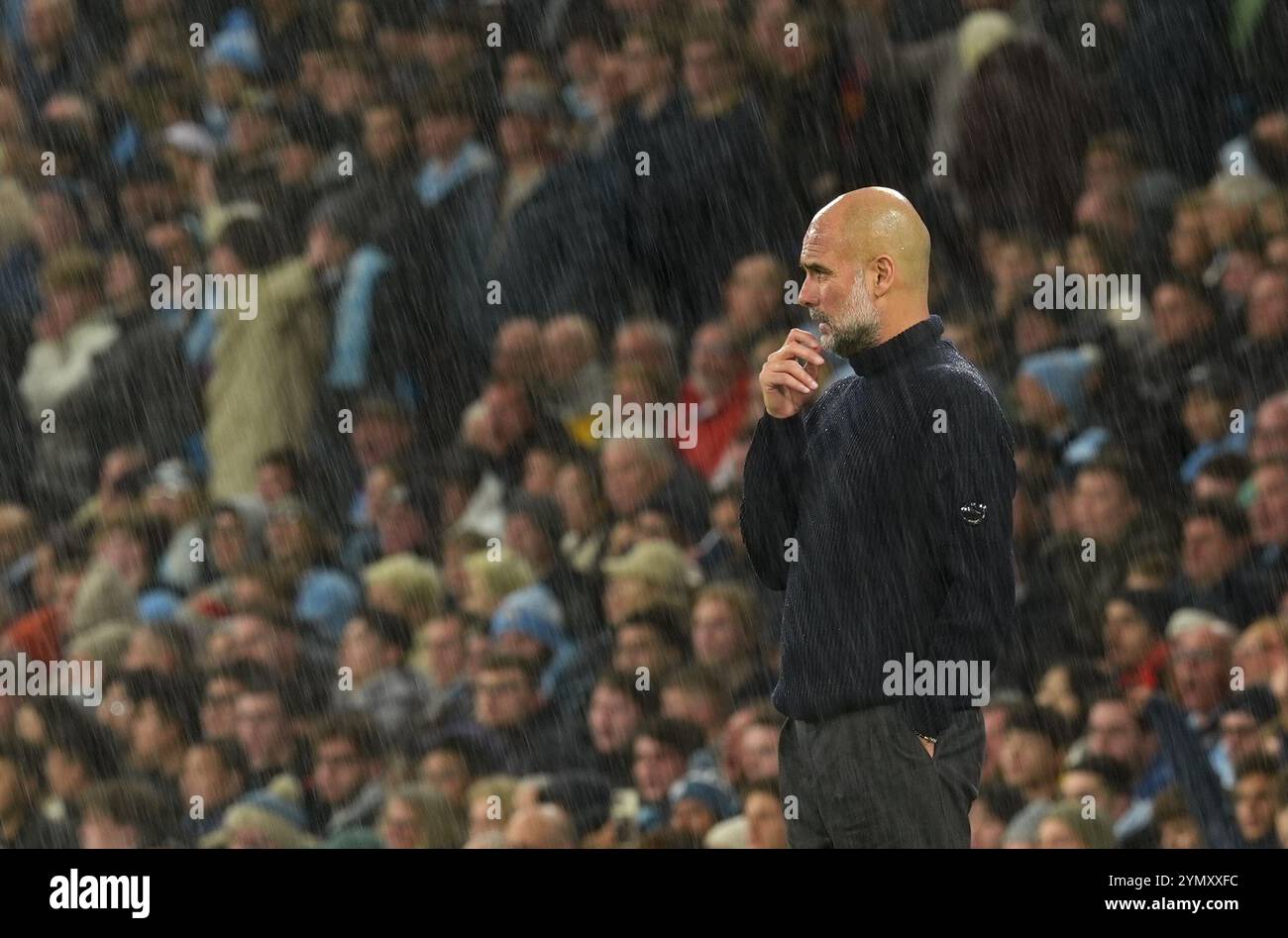 Manchester City manager Pep Guardiola in the rain during the Premier ...
