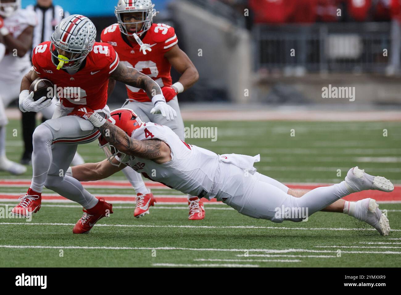 Indiana linebacker Aiden Fisher, right, tackles Ohio State receiver ...