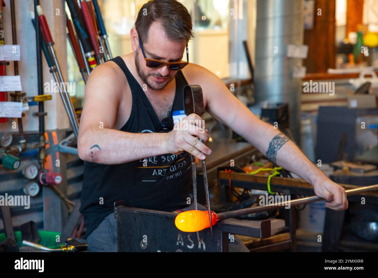 Glass blower making a drinking glass Stock Photo - Alamy