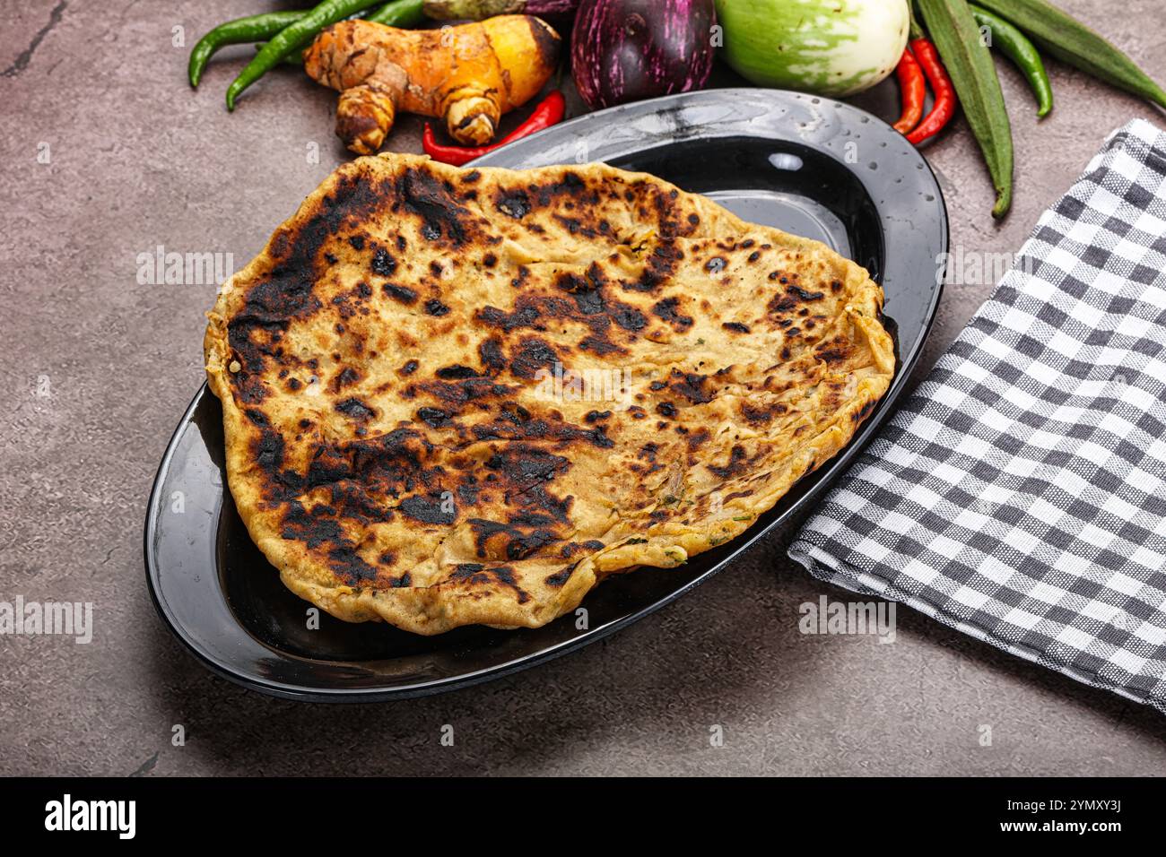 Indian cuisine stuffed Aloo paratha - bread with potato Stock Photo - Alamy