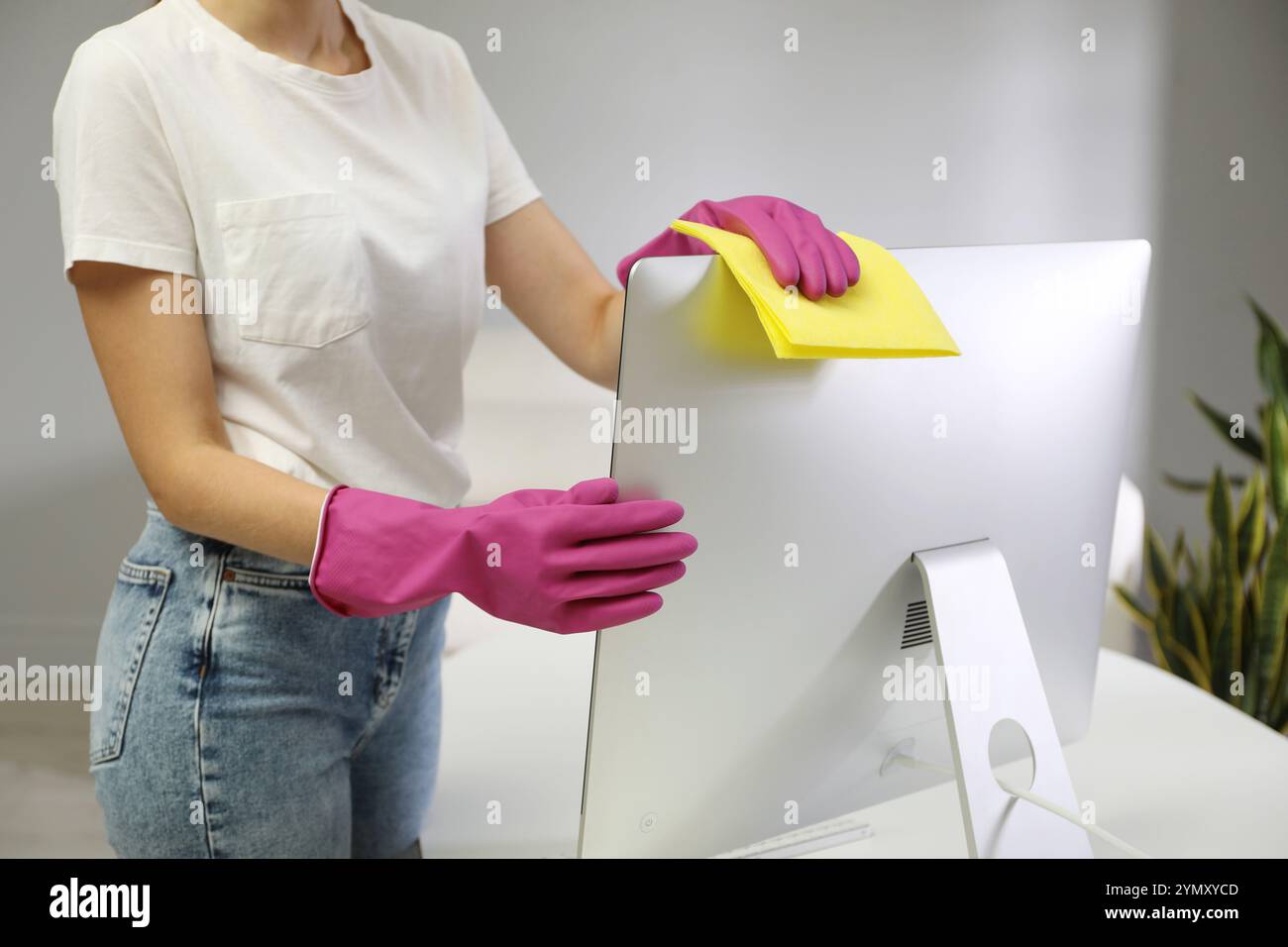 Young woman cleaning computer hi-res stock photography and images - Alamy