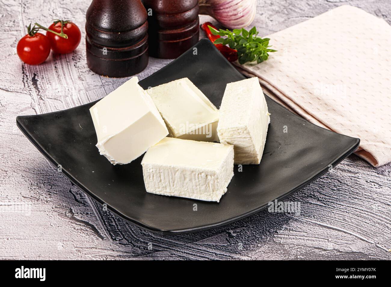 Greek traditional cuisine - Feta cheese bricks Stock Photo - Alamy