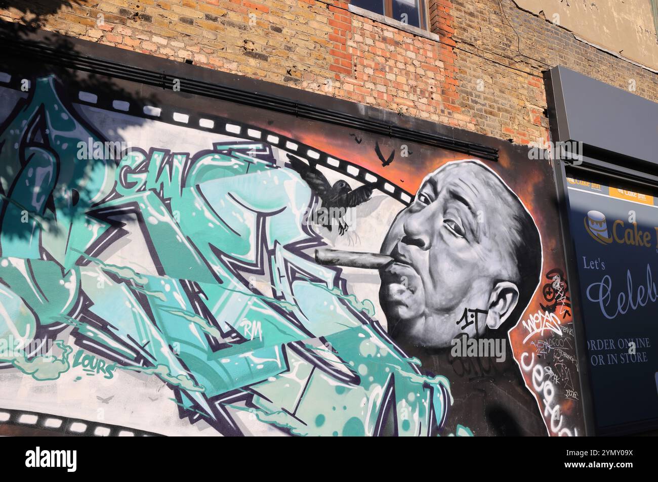 Street mural of famous film director Alfred Hitchcock, just off ...