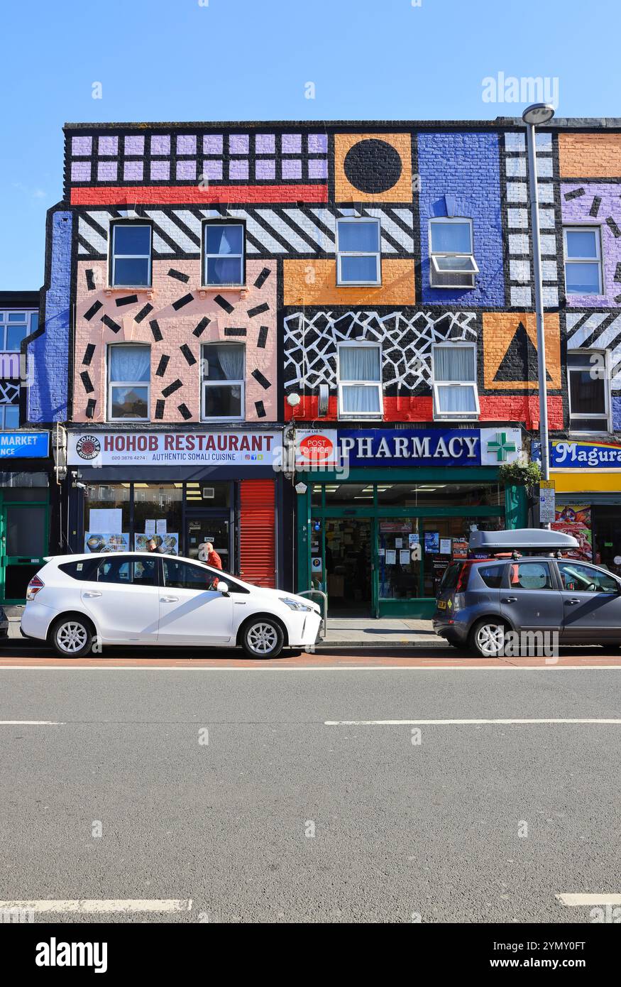 Block of shops called 'Walala Parade' transformed into riotous colour ...
