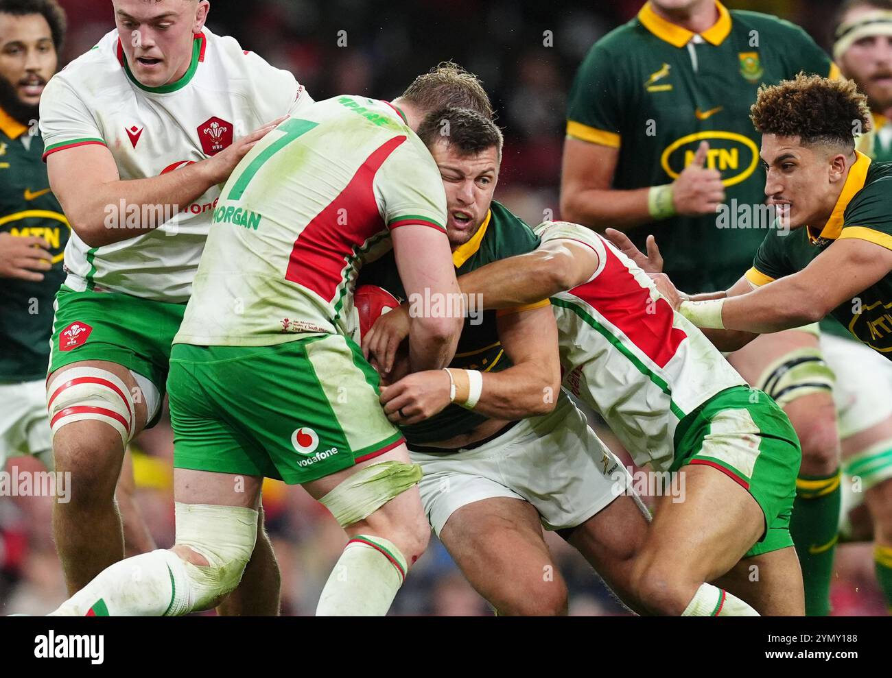 South Africa's Handre Pollard (centre) is tackled by Wales' Jac Morgan ...