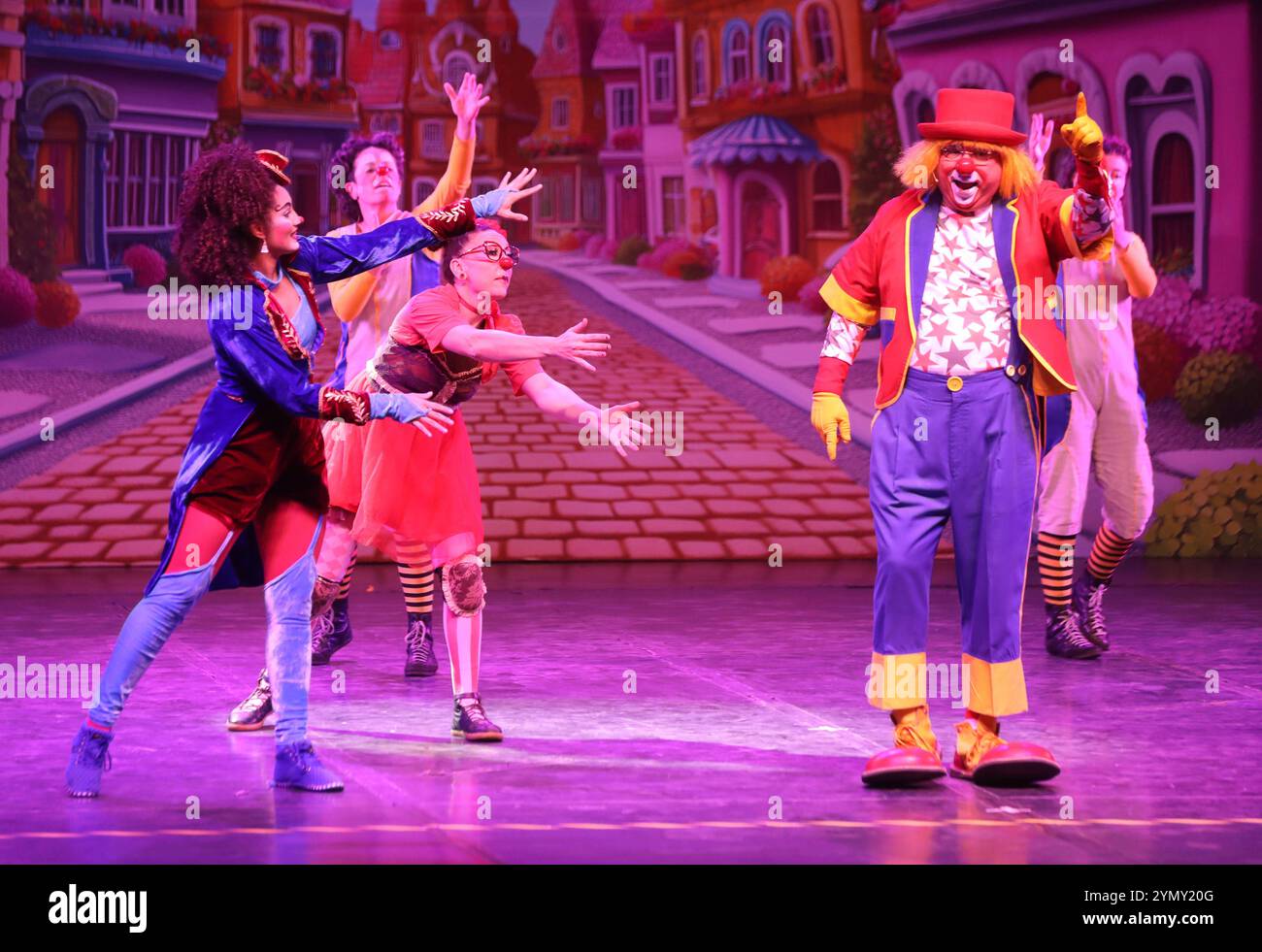 Leisure & Entertainment Artists dressed as clowns perform on stage ...