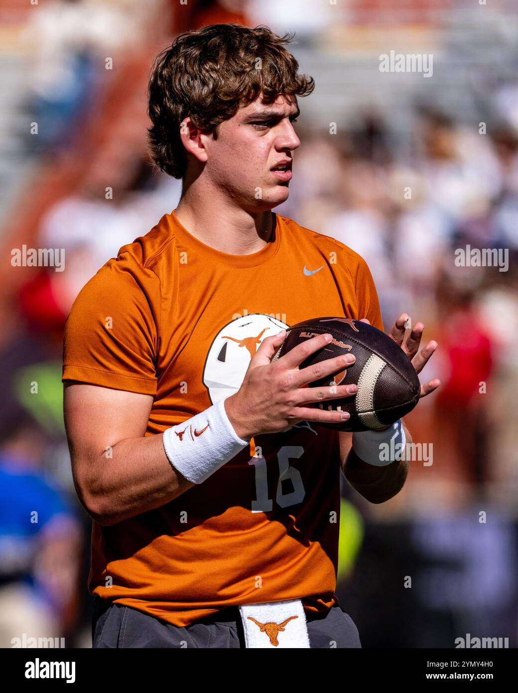 Nov 23, 2024.Arch Manning #16 of the Texas Longhorns warms up before ...