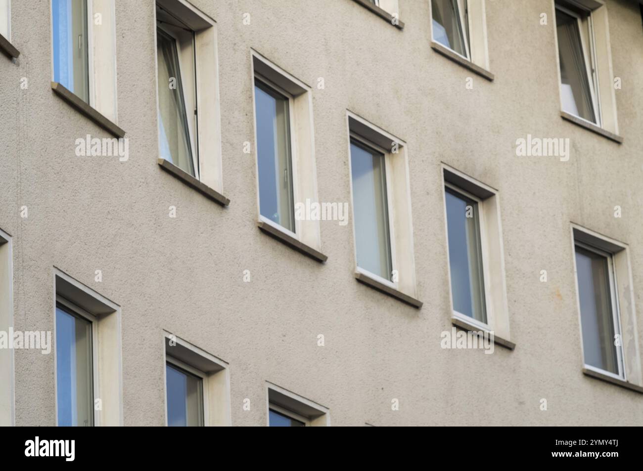 Rows of windows on an older residential building Stock Photo - Alamy