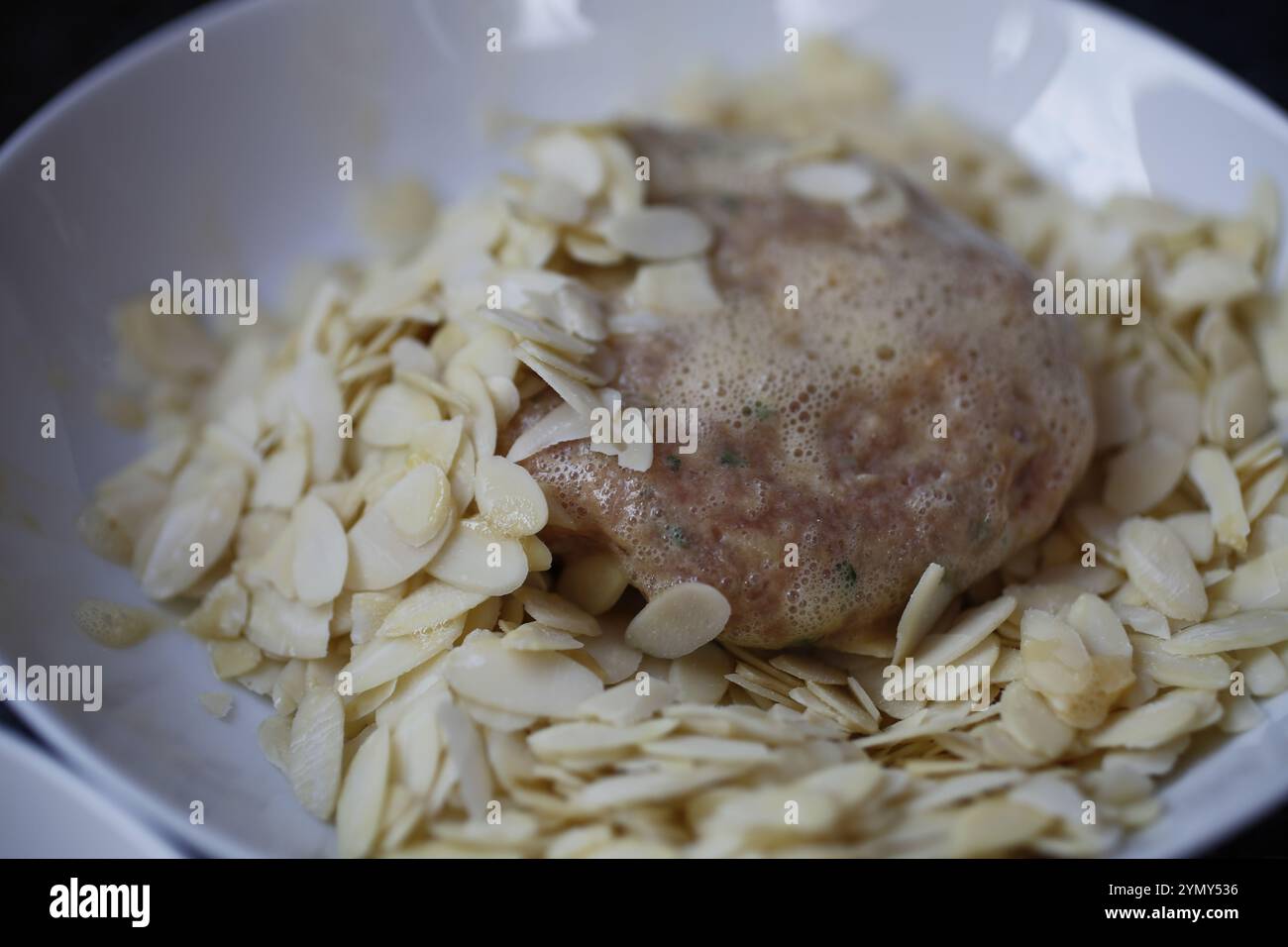 Swabian cuisine, preparation of meatballs in almond coating, mixed ...