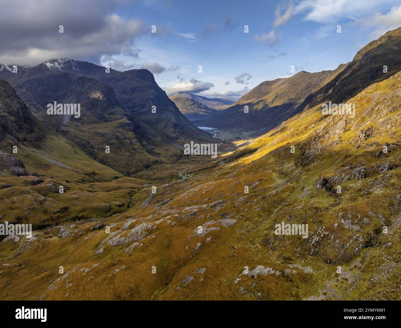 Cloudy mood, morning light, road, valley, mountains, aerial view ...