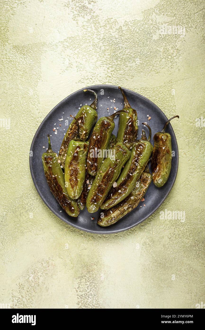 Fried padron pepper, in a frying pan, with olive oil, and sea salt ...