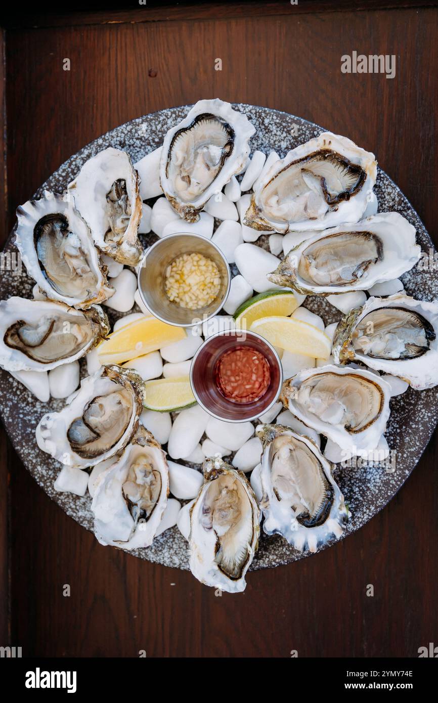 Oyster served sauce on hi-res stock photography and images - Alamy