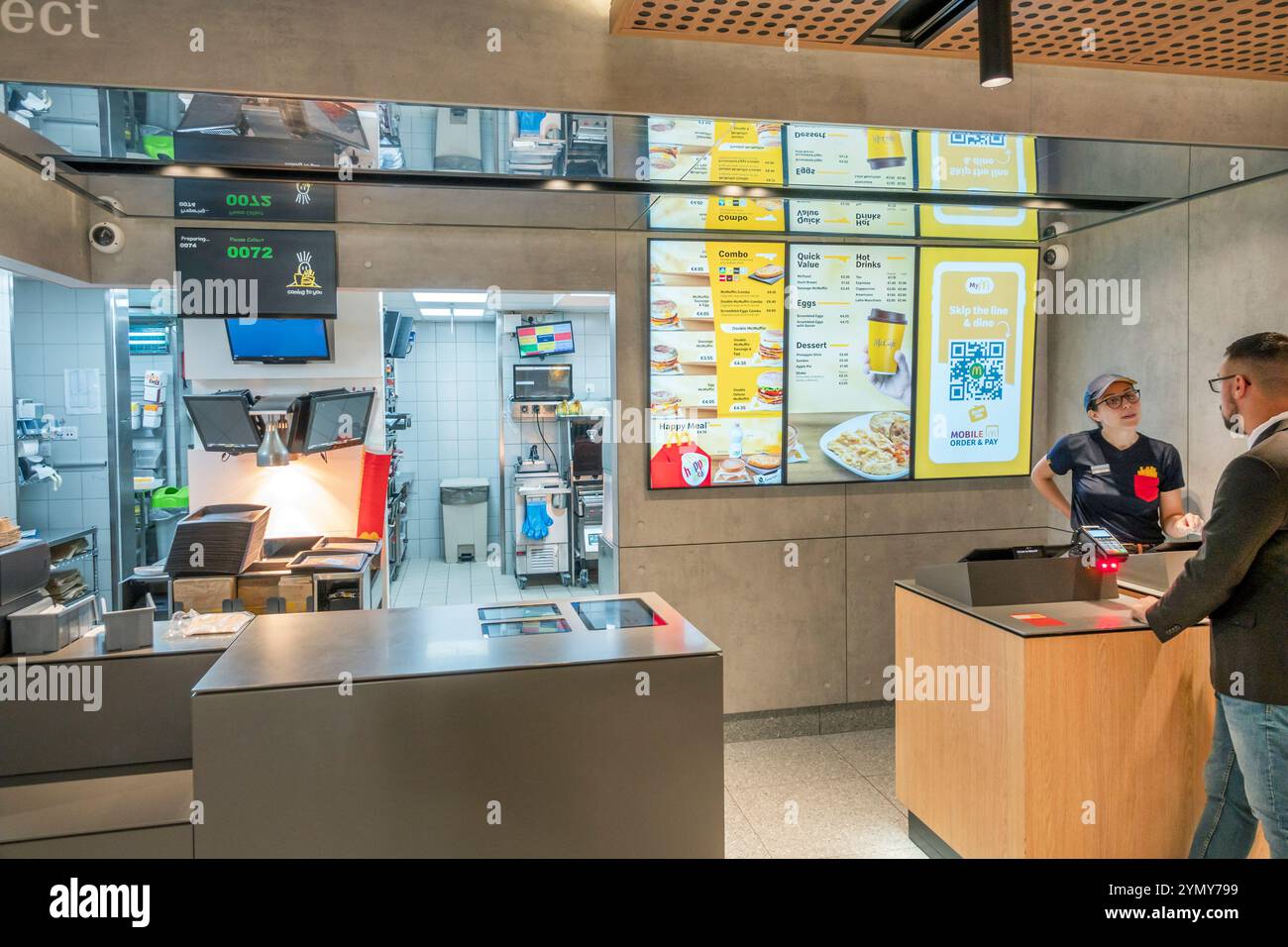Valletta Malta,McDonald's fast food hamburger restaurant,inside interior,customer counter,woman ...