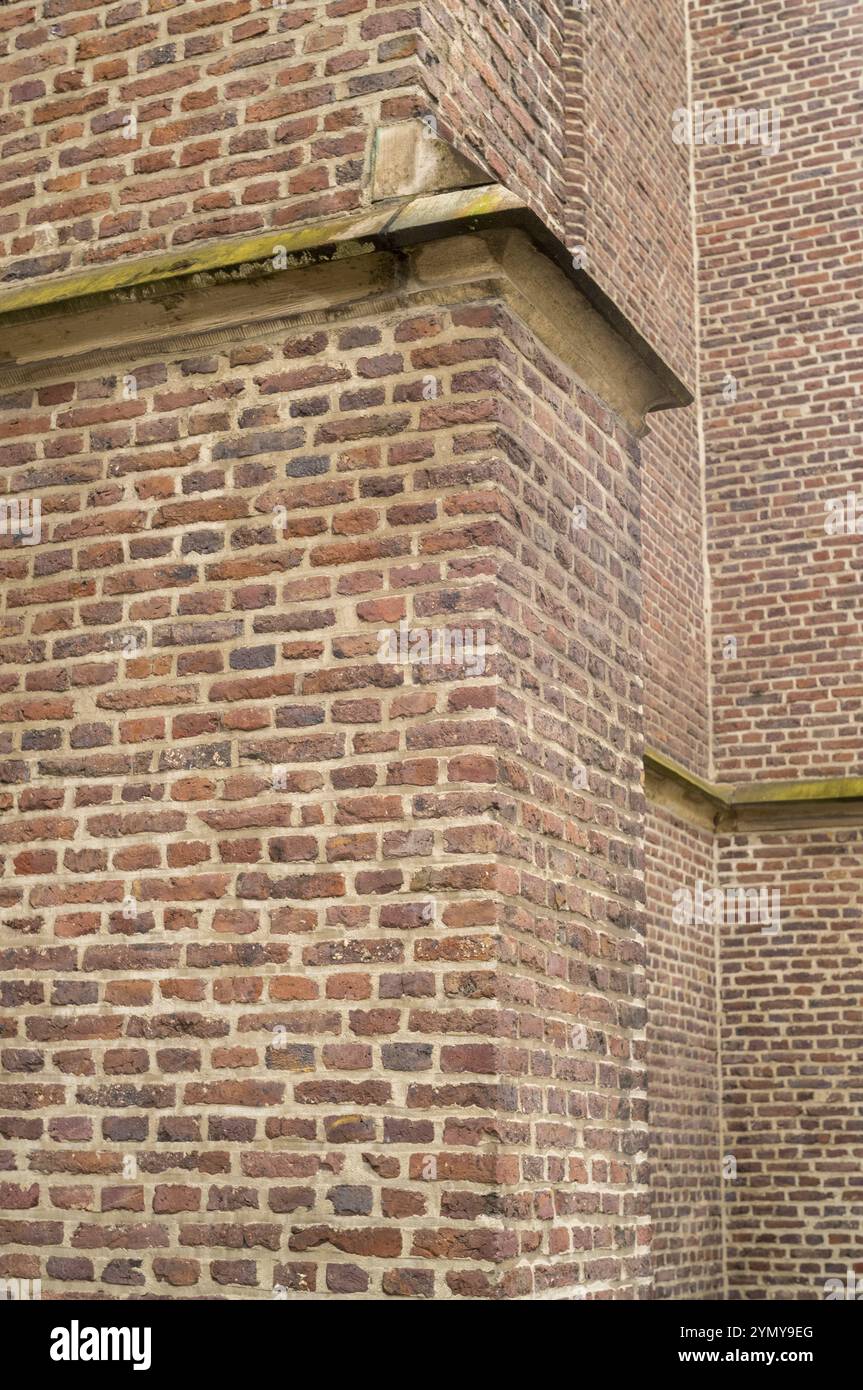 High brick wall with corners and projections Stock Photo - Alamy