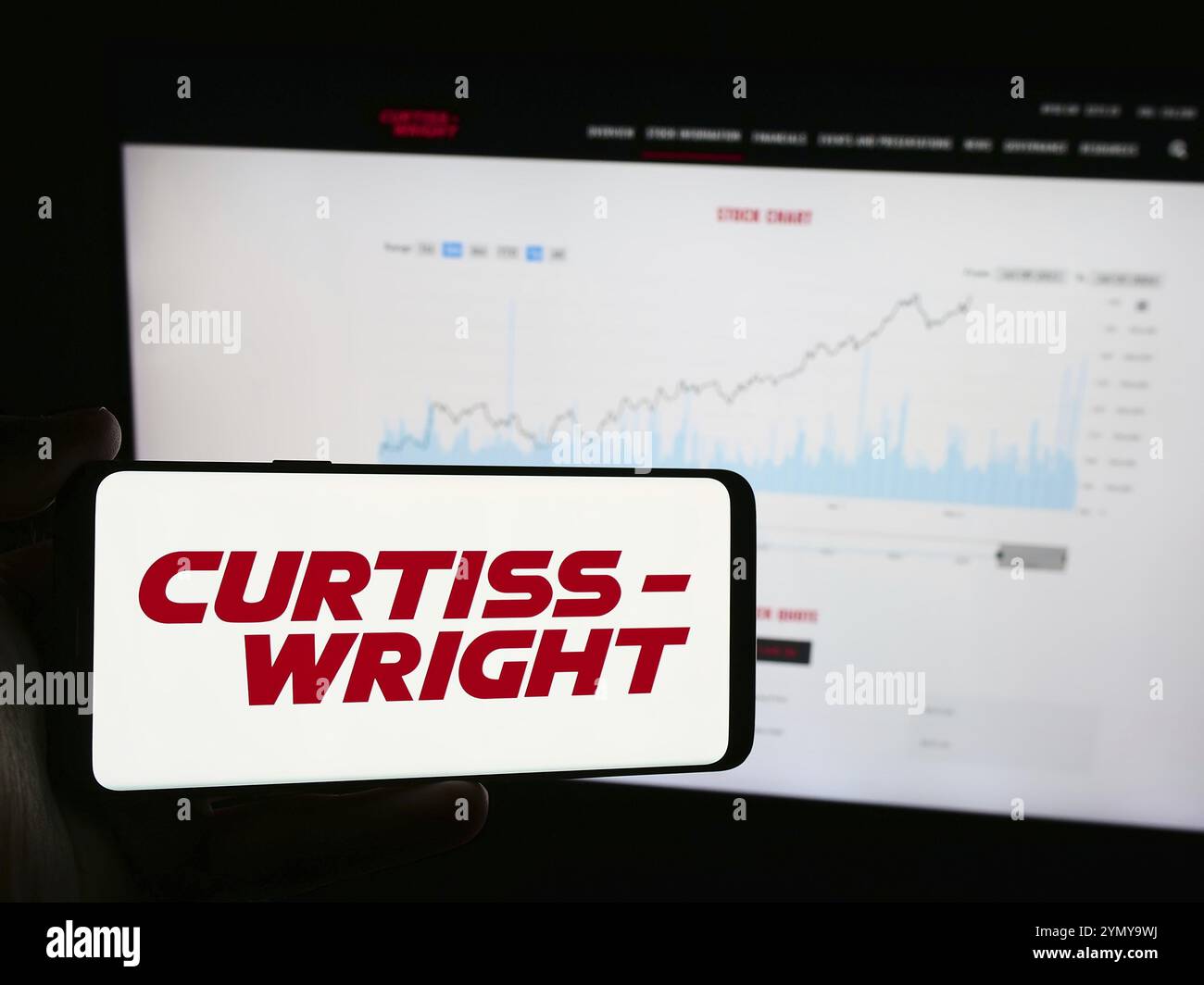 Stuttgart, Germany, 07-05-2024: Person holding mobile phone with logo of American aerospace ...