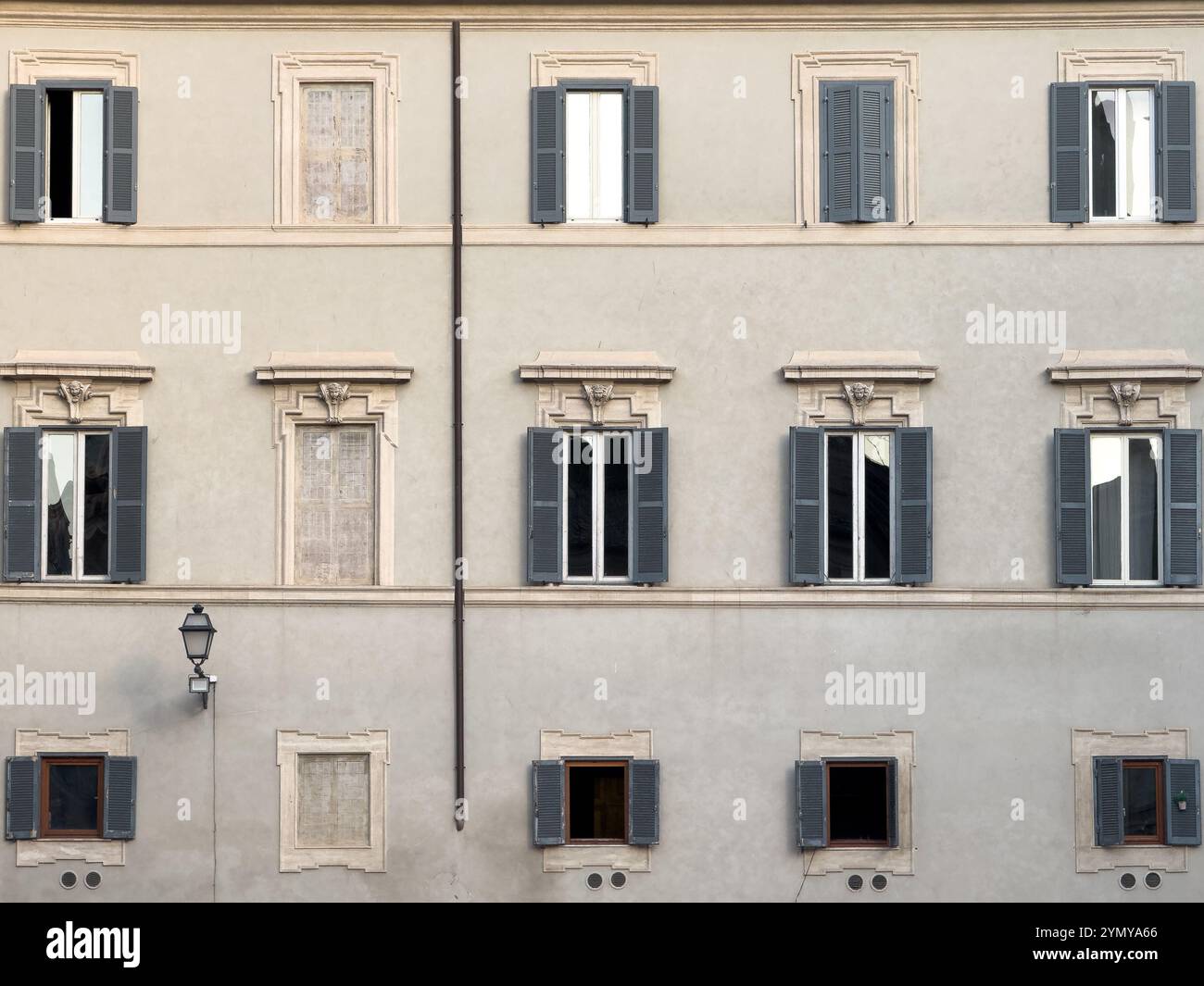 A building facade with shuttered windows Stock Photo - Alamy