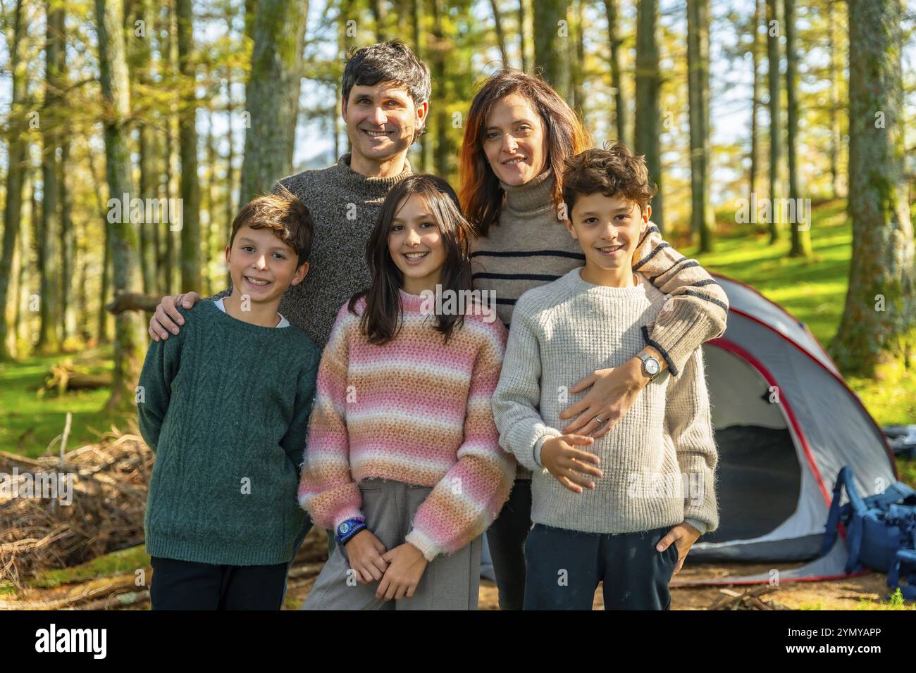 Portrait of a happy caucasian family with three children enjoying ...