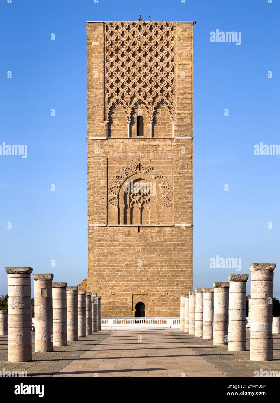 A tall, intricately designed minaret, stands in the center of a large ...