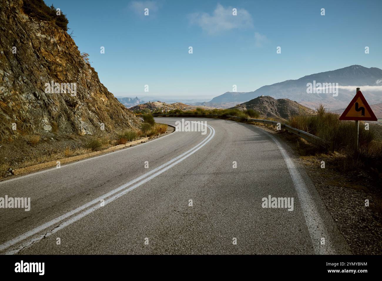 Sharp turn on mountain road Stock Photo - Alamy
