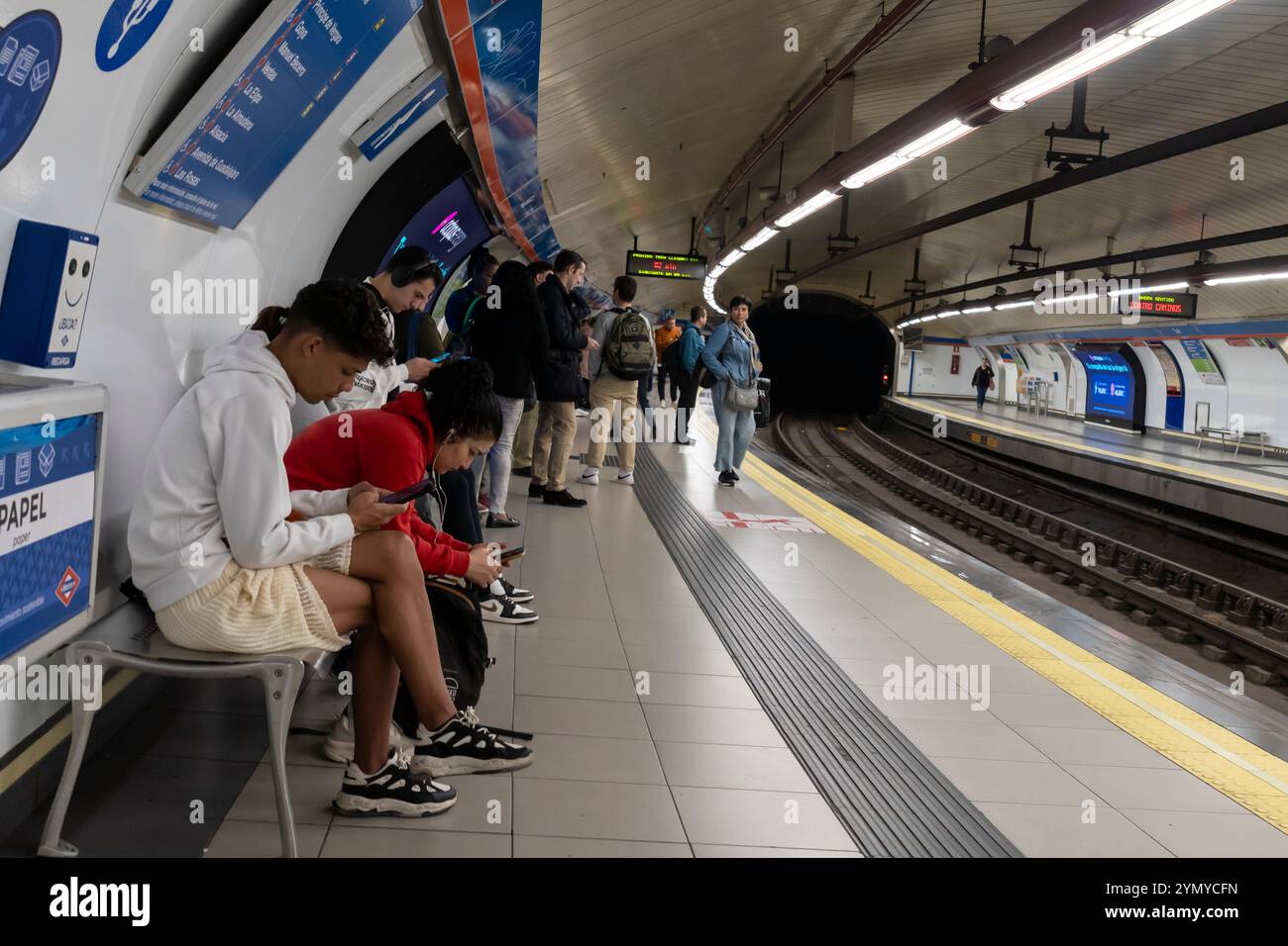 Passengers wait for the next tain to arrive at the Sol Metro Station in ...