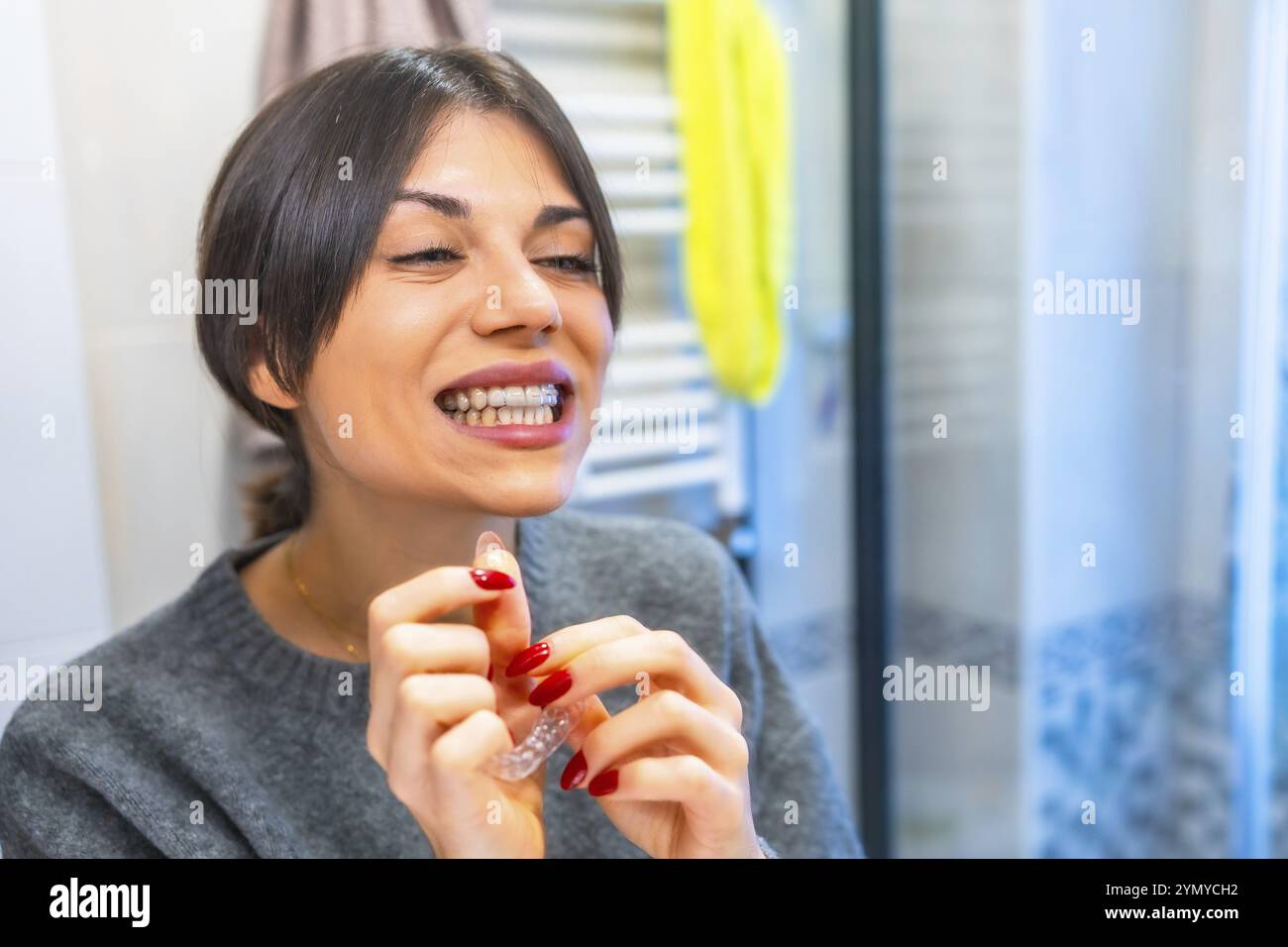 Adult caucasian beauty woman looking at the mirror wearing transparent ...