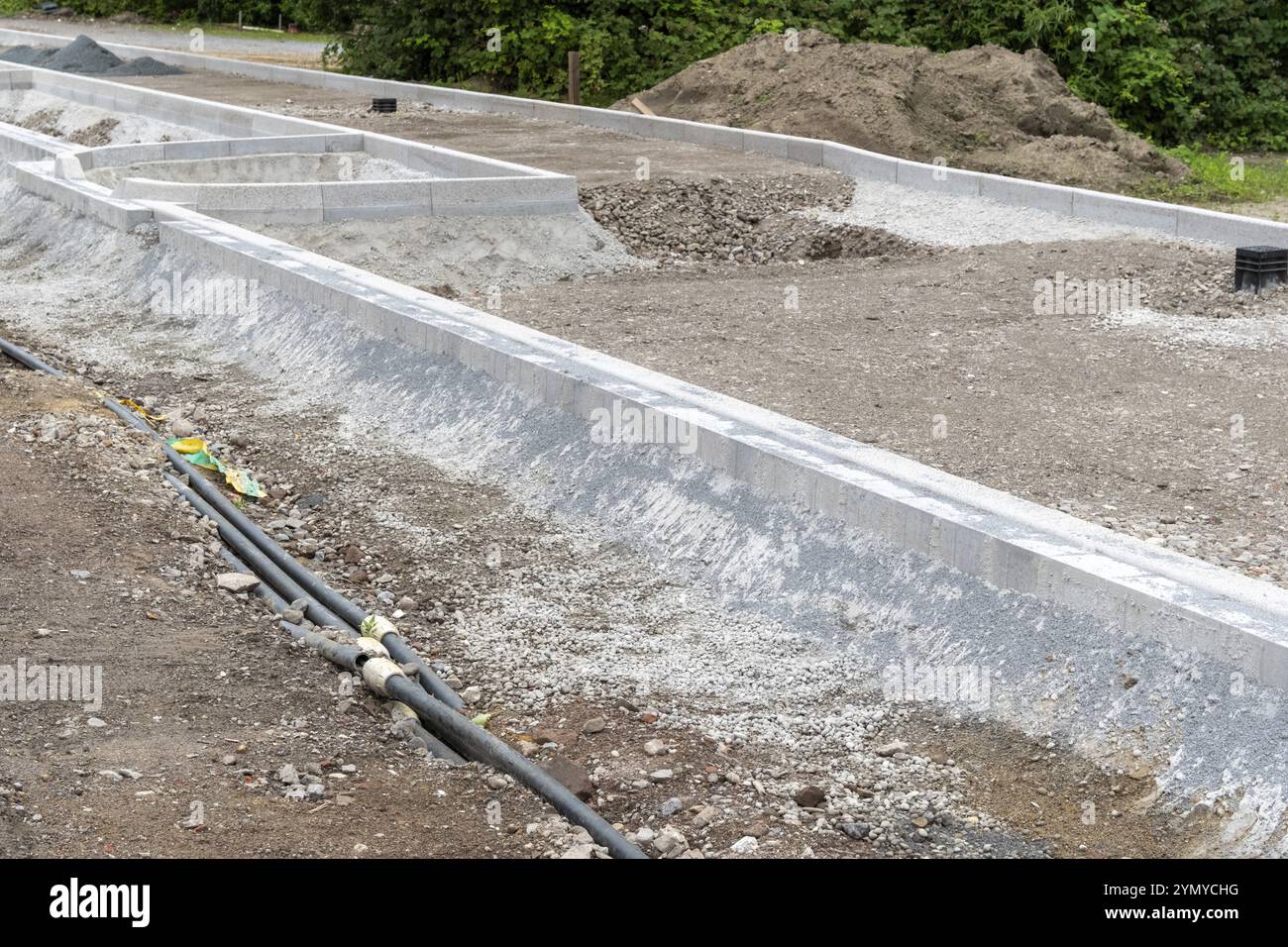 A new road with carriageway and sidewalk is being built Stock Photo - Alamy