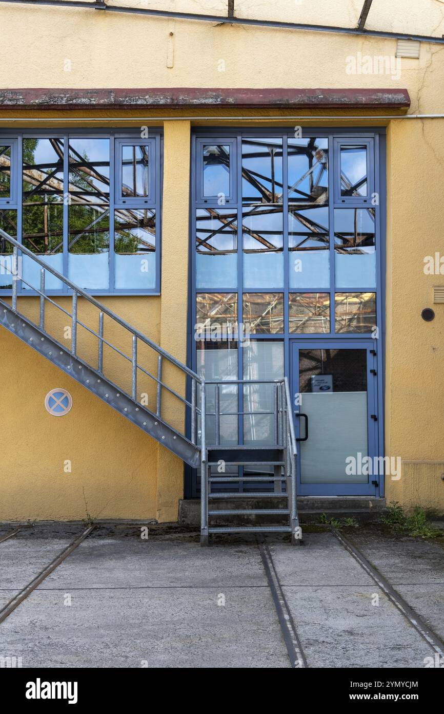 External staircase on yellow commercial building Stock Photo - Alamy