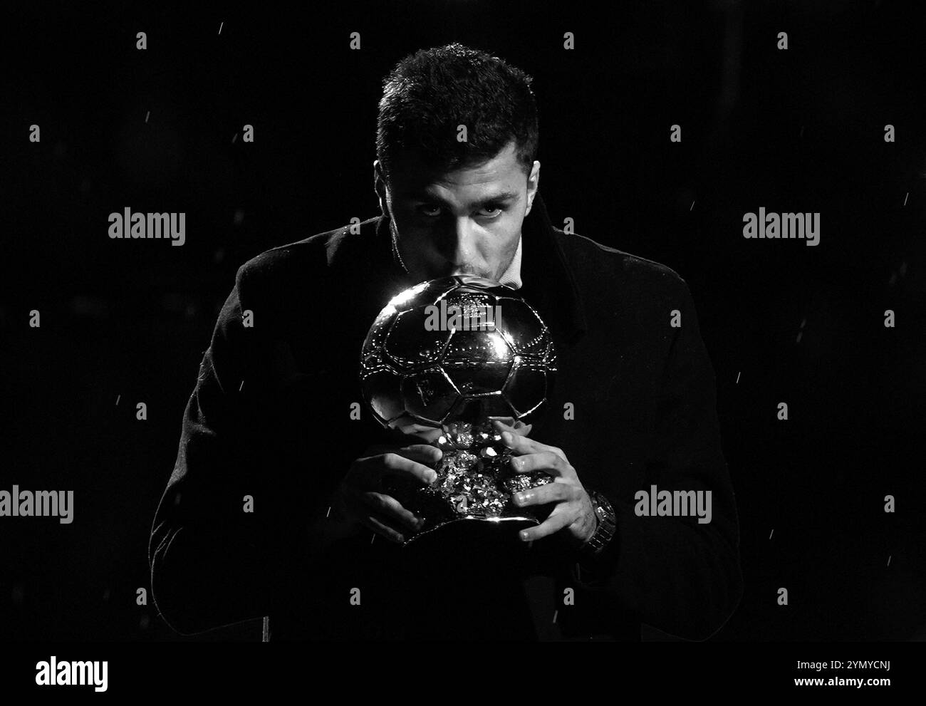 Manchester City's Rodri poses with the Ballon d'Or trophy before the ...