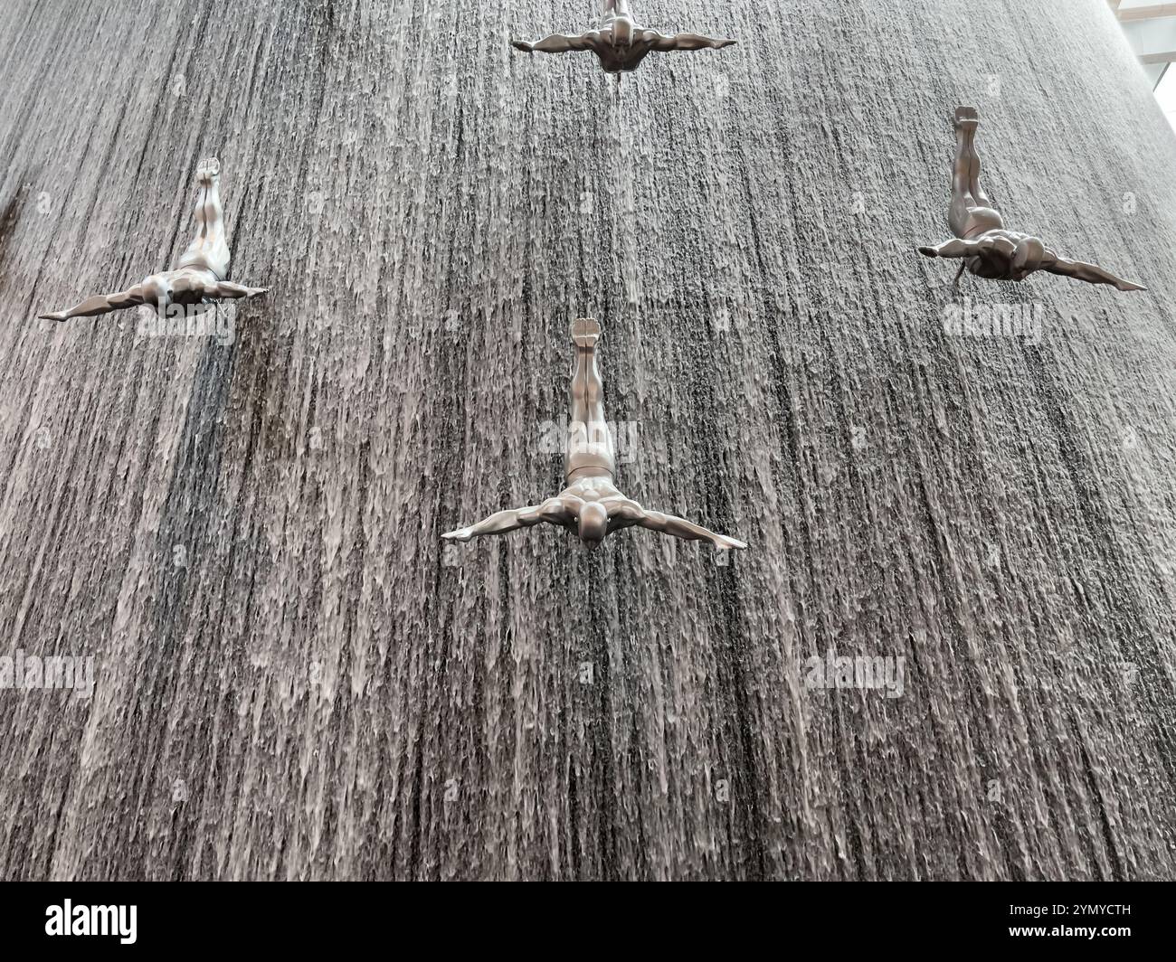 Four divers plunge into a massive waterfall Stock Photo - Alamy