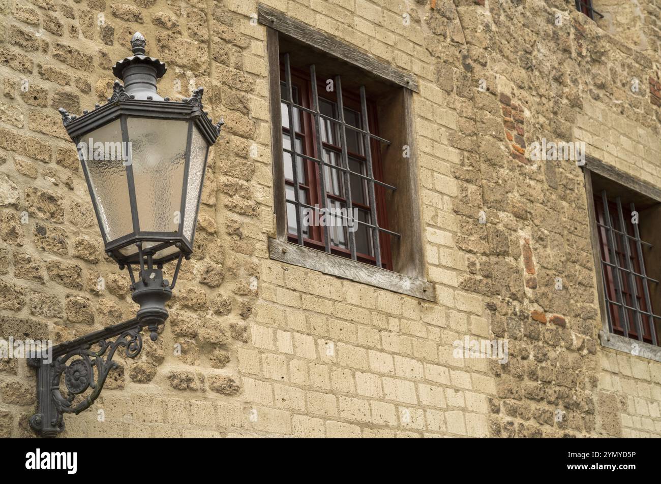 Details of a medieval building, window and street lamp Stock Photo - Alamy