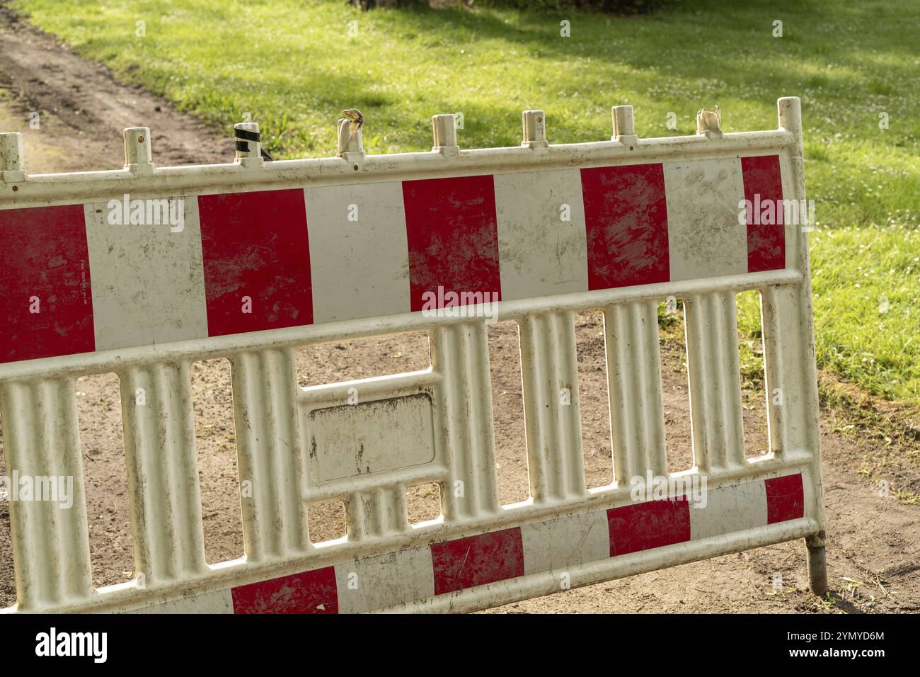 Construction site, white red barrier along the road Stock Photo - Alamy