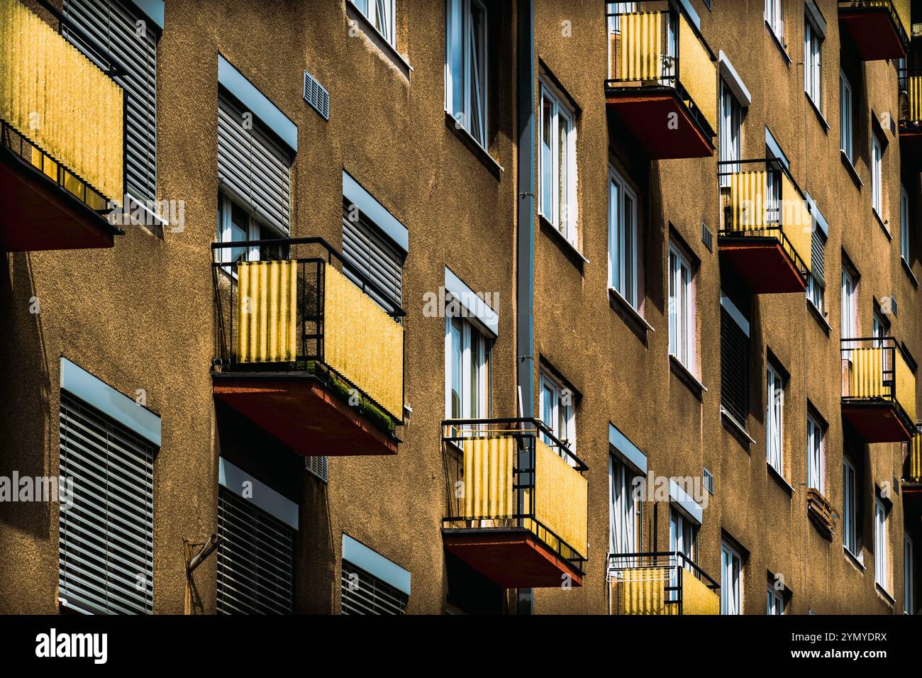 Urban Residential Facade with Vibrant Balconies and Minimalist Design ...