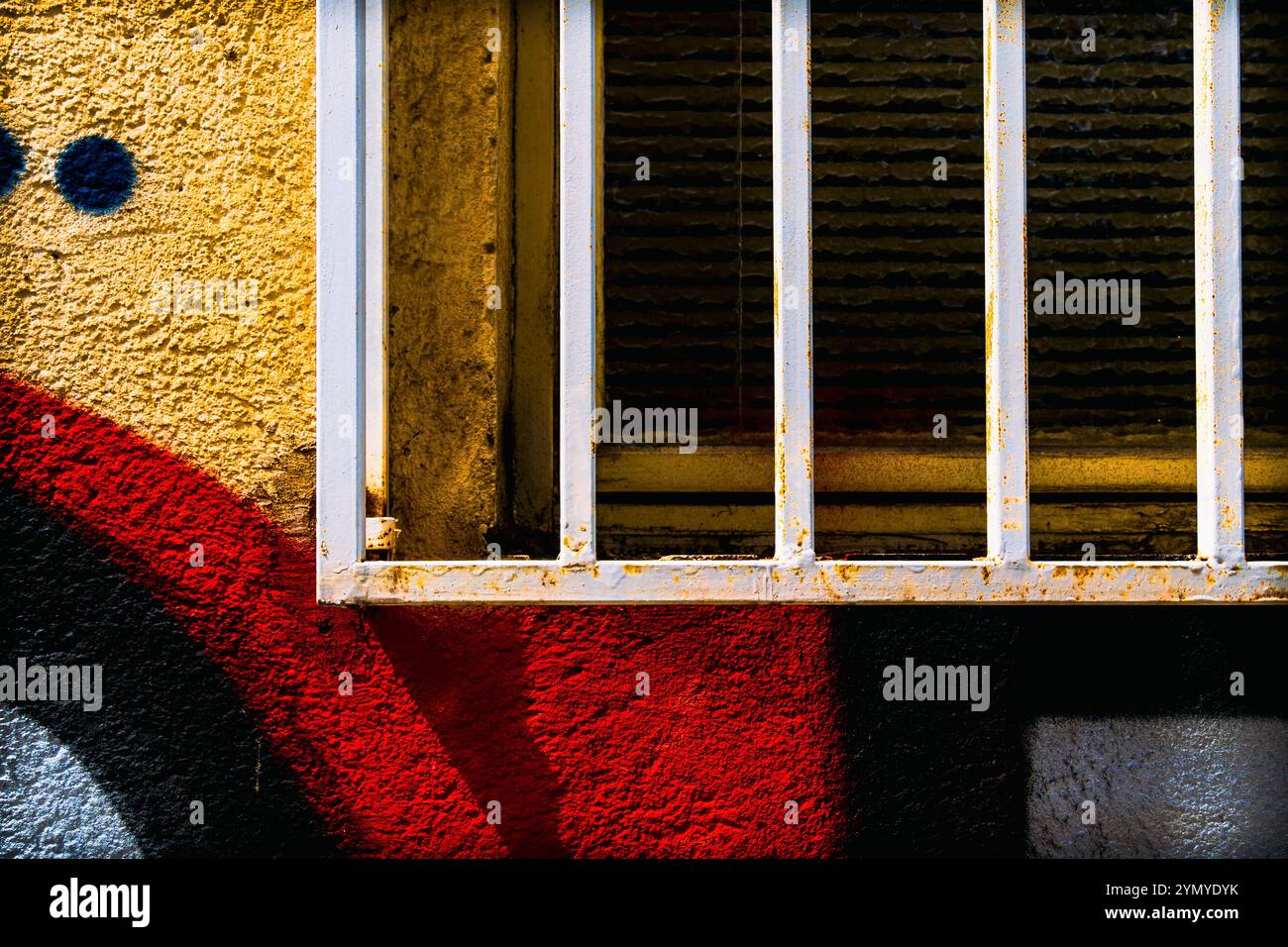 Graffiti-Decorated Wall with a Rusty Window Frame Capturing Urban Decay ...