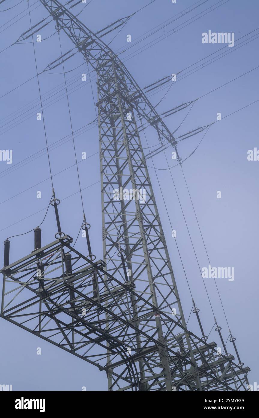 Large high voltage pylons for industry Stock Photo - Alamy