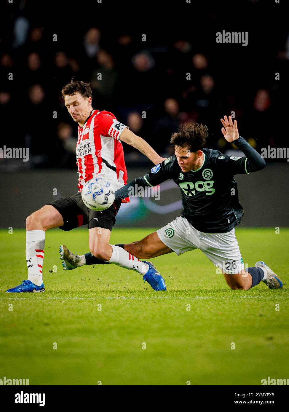 EINDHOVEN, NETHERLANDS - NOVEMBER 23: Olivier Boscagli of PSV battles for possession with Thom ...