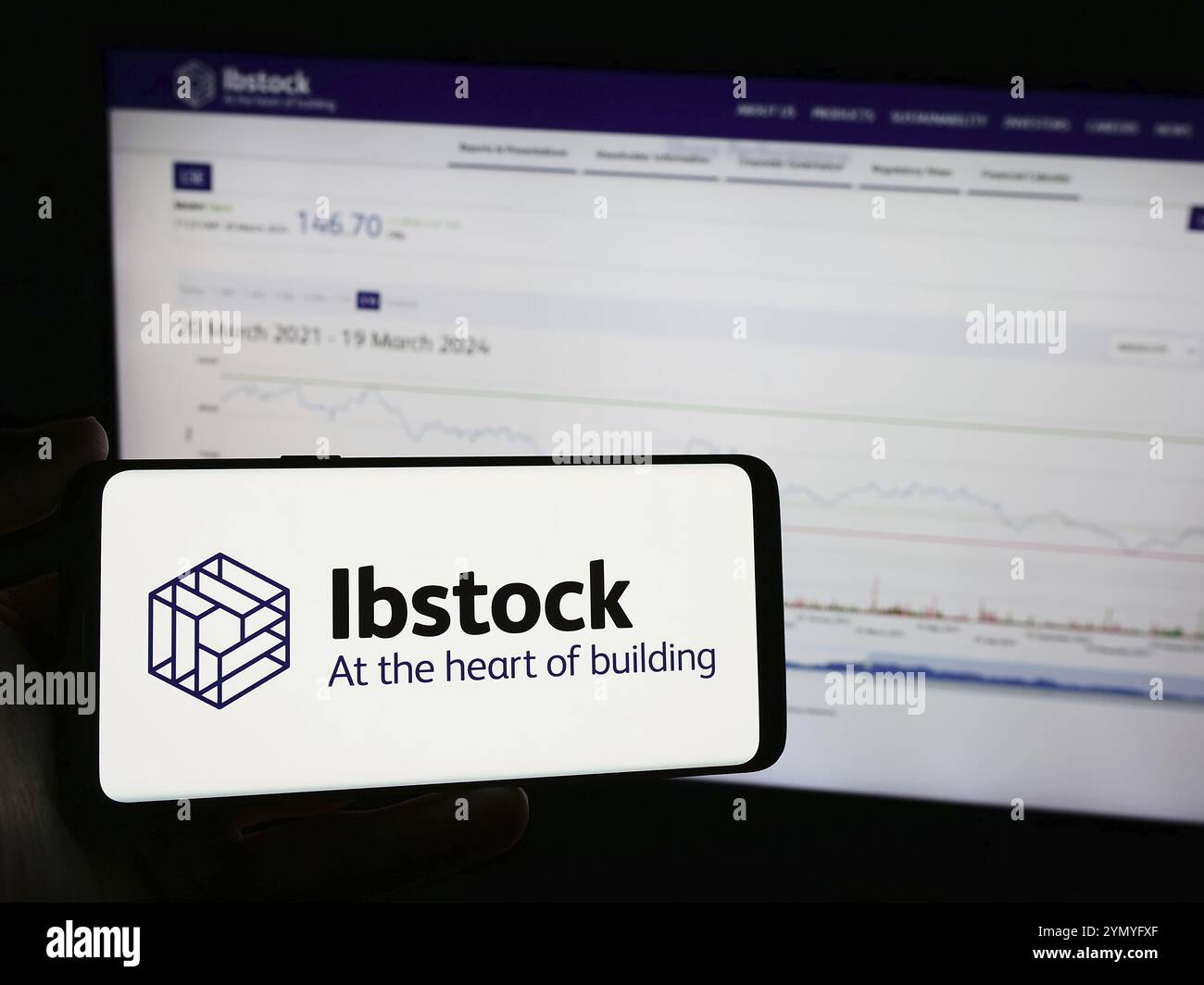 Stuttgart, Germany, 03-20-2024: Person holding mobile phone with logo of British building ...