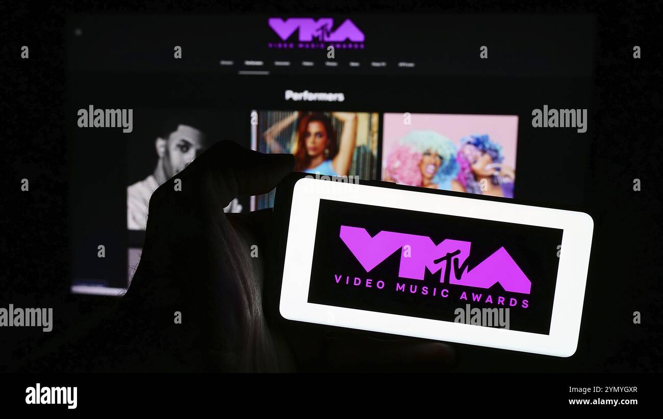 Stuttgart, Germany, 03-19-2024: Person holding mobile phone with logo ...