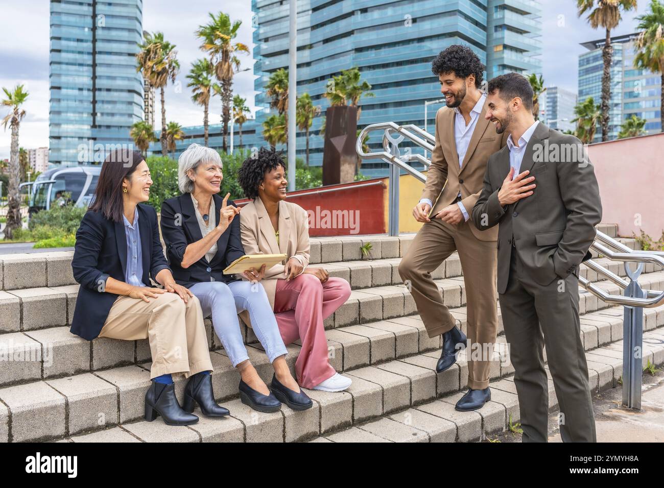 Relaxed and informal business meeting of multi-ethnic colleagues in an ...