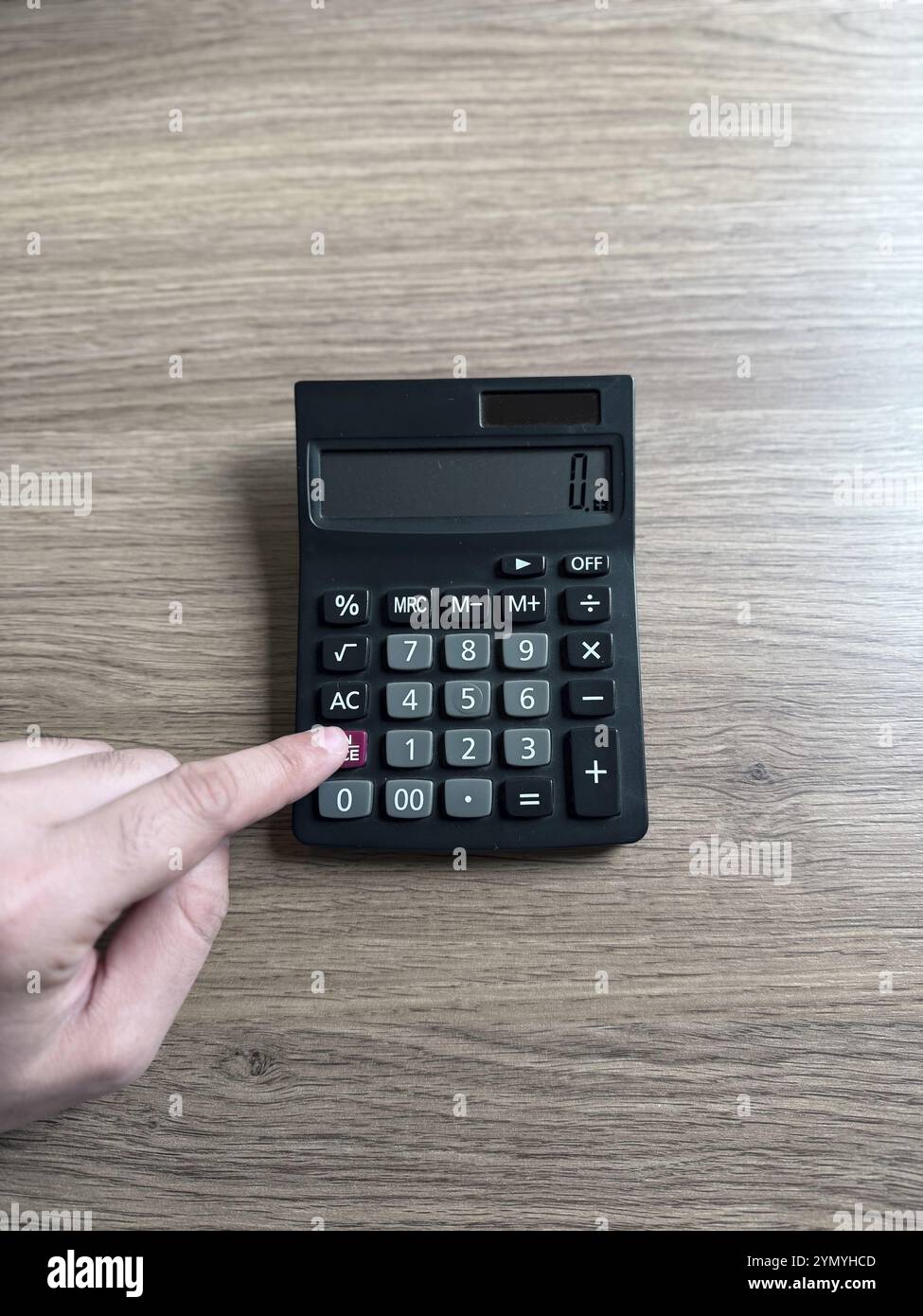 Hand pressing calculator button hi-res stock photography and images - Alamy