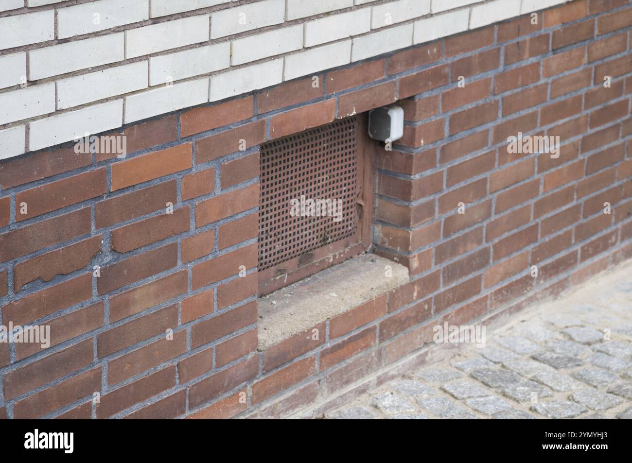 Barred basement window with socket Stock Photo - Alamy