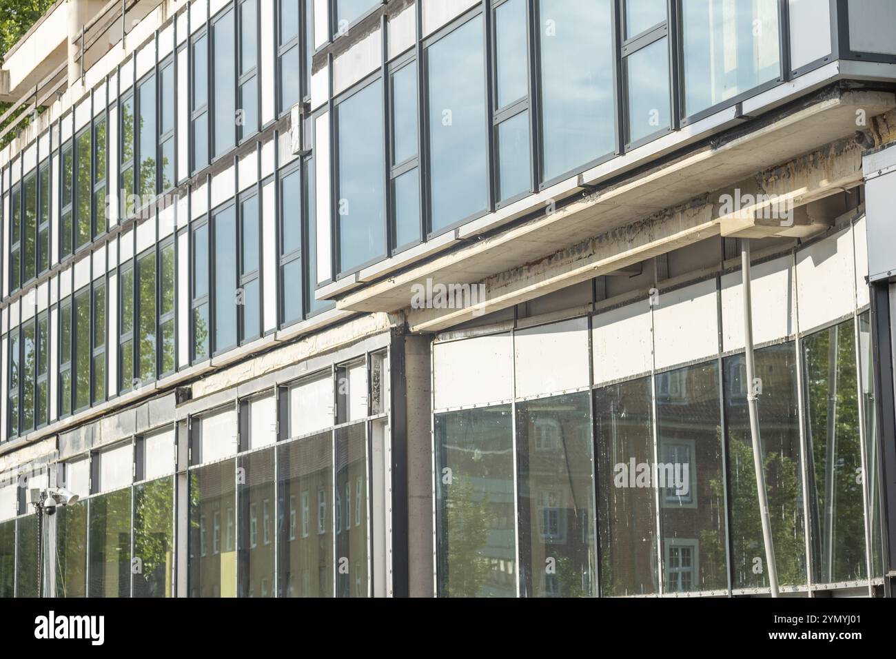 Dilapidated office building in the sun Stock Photo - Alamy